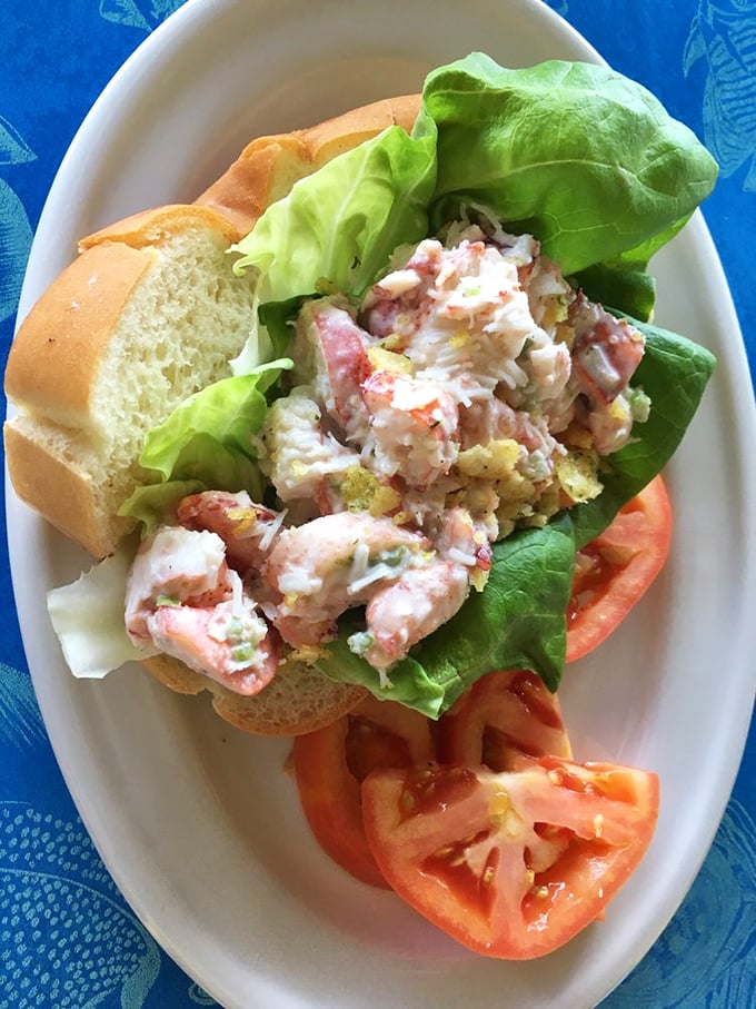 A lobster roll so generously stuffed it practically defies the laws of sandwich physics while delivering pure New England nostalgia.