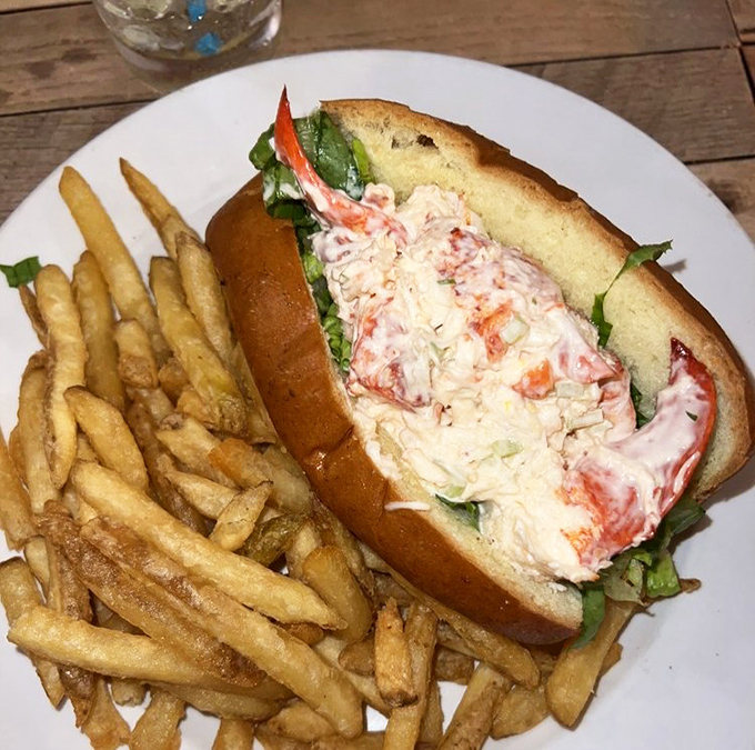 A lobster roll that doesn't need New England's permission &ndash; chunks of sweet lobster meat nestled in a buttery roll alongside crispy fries.