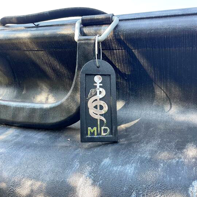 The MD tag features the caduceus symbol &ndash; medicine's ancient logo that says, "Trust me, I went to school for this."