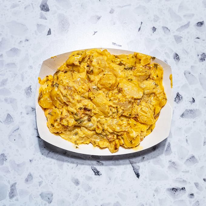 Mac and cheese that doesn't just comfort&mdash;it embraces you like an old friend who's really good at cooking and terrible at diets.