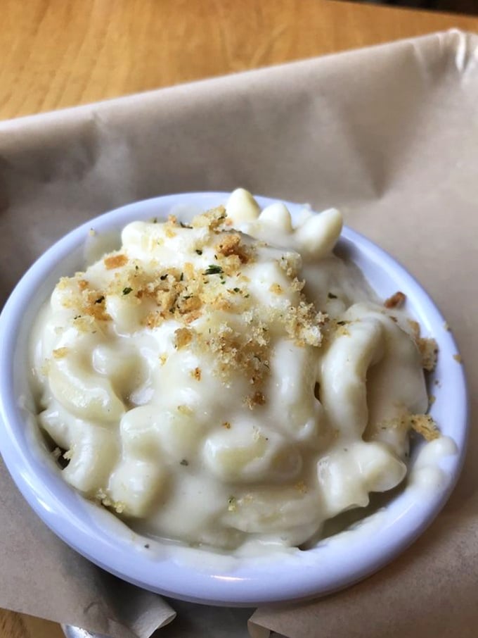 Mac & cheese that doesn't come from a blue box. This creamy masterpiece with its golden breadcrumb crown deserves its own zip code.