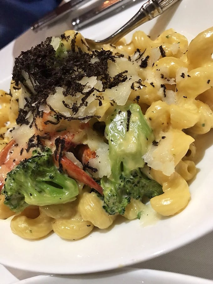 Mac and cheese transcends childhood memories here, elevated with truffle, seasonal vegetables, and enough cheese to make Wisconsin proud.