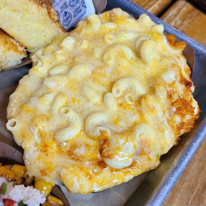 Mac and cheese that achieves the impossible golden ratio of creamy to crusty, making you wonder if cheese scientists were consulted in its creation.
