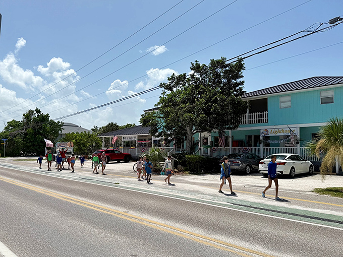 The kind of Main Street where you can actually find locals shopping. No chain stores, just palm trees standing guard over brick streets.