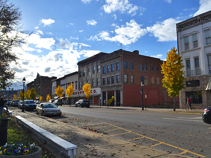 Autumn transforms Main Street into a painter's palette, where golden trees frame historic buildings that have witnessed generations of small-town stories.