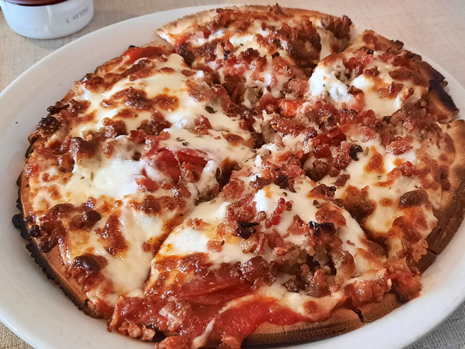 Their meat lovers pizza doesn't just have toppings—it has a carnivorous congregation celebrating atop a perfectly crisp crust. Vegetarians, avert your eyes.