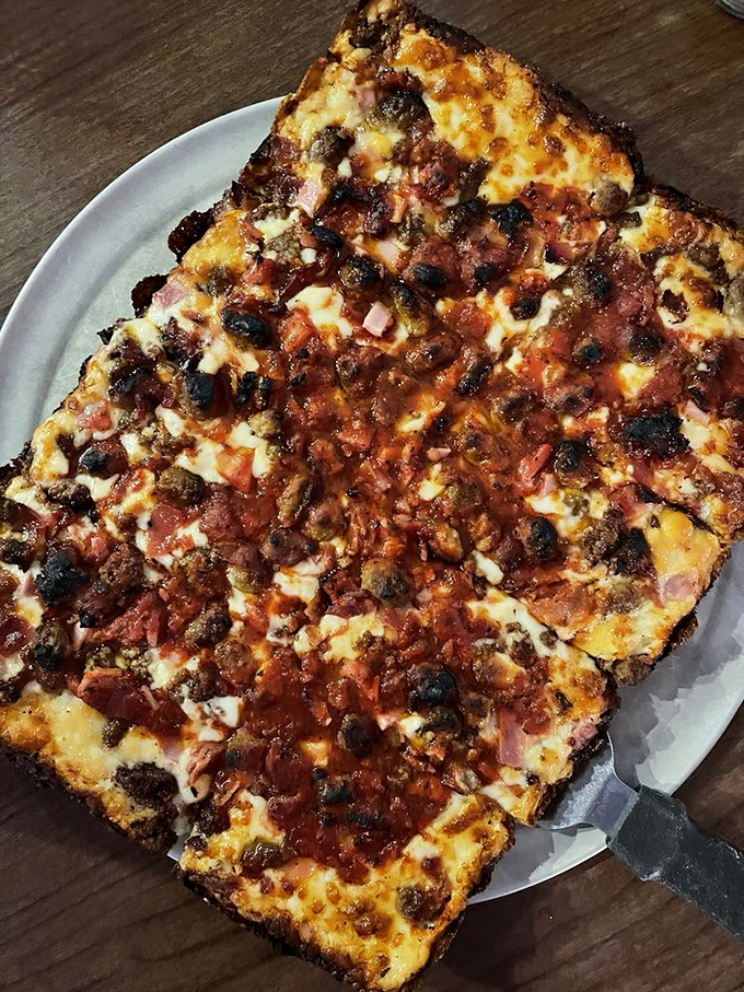 Not so much a pizza as a declaration of carnivorous intent. The meat lovers' pie that makes vegetarians question their life choices.