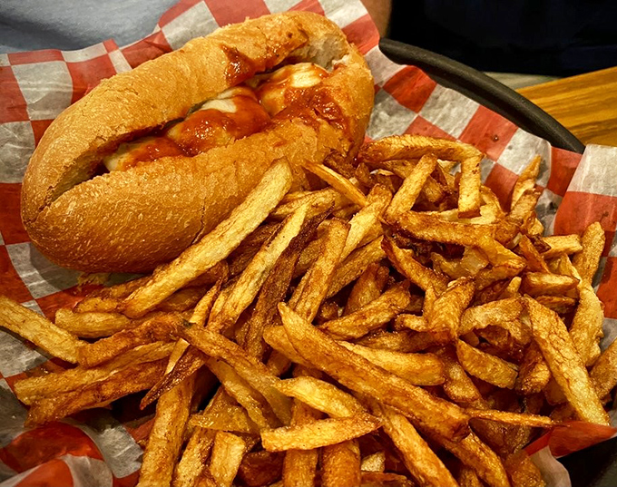 A meatball sandwich that doesn't need fancy packaging&mdash;just a checkered paper and your undivided attention. Those hand-cut fries aren't just sides; they're co-stars.