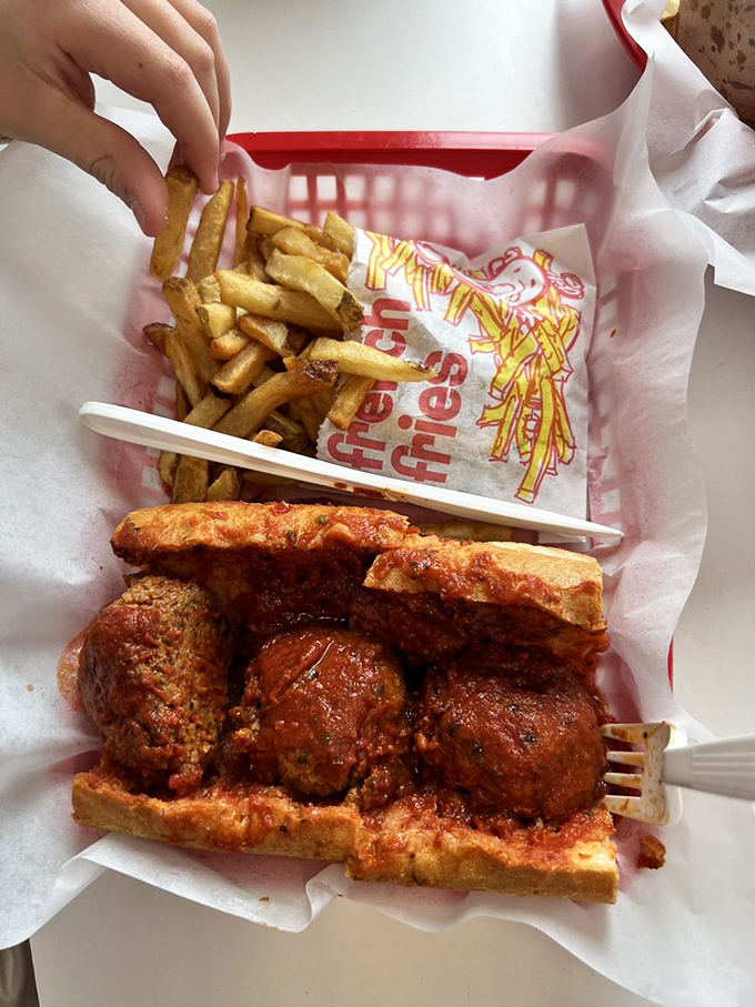 Meatballs the size of baseballs nestled in crusty bread with marinara that would make your Italian grandmother nod in approval. The perfect comfort food trifecta.