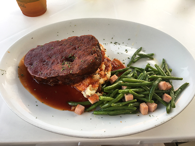 Meatloaf that's dressed for success, surrounded by a moat of savory gravy and green beans that actually make you want to eat your vegetables.