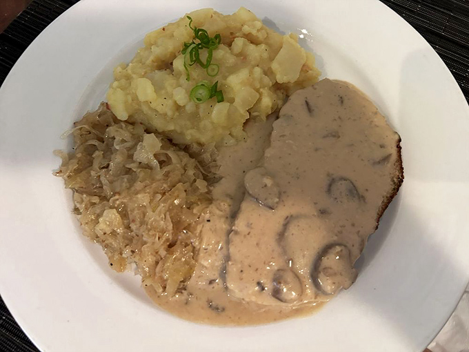 German meatloaf with sauerkraut &ndash; comfort food that hugs you from the inside. This plate says "Willkommen" better than any doormat ever could.