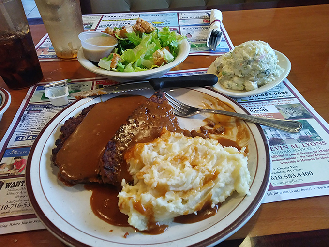 Meatloaf that would make your grandmother both jealous and proud, swimming in gravy that deserves its own fan club.