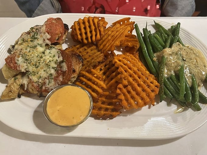 Sweet potato waffle fries and perfectly cooked protein&mdash;a plate that proves vegetables can party too. The sauce adds that "where have you been all my life?" element.