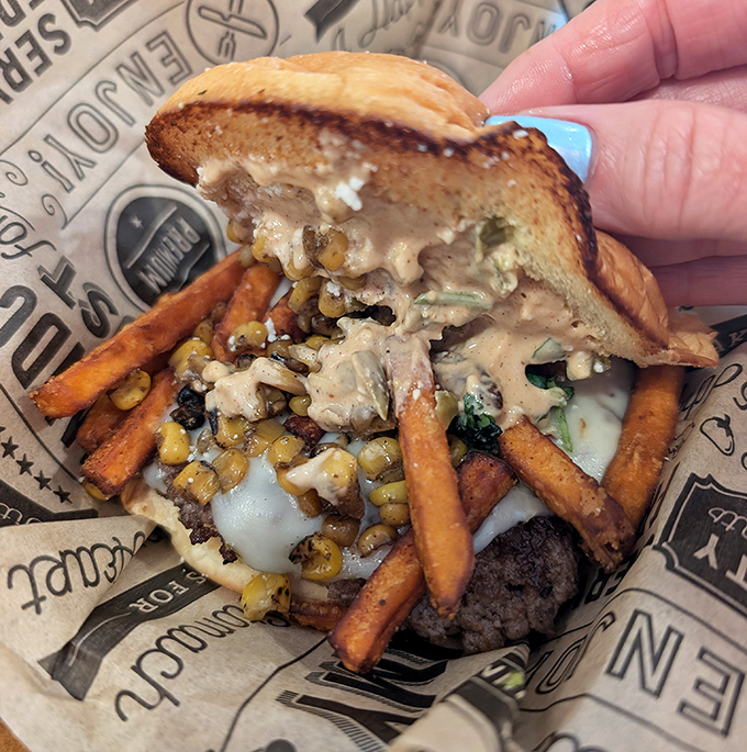 When a burger meets Mexican street corn, magic happens. That pickle slice is the exclamation point on a sentence of flavor.
