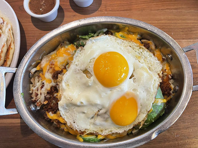 This sizzling skillet is what happens when breakfast decides to dress for success &ndash; those sunny-side-up eggs are practically winking at you. 