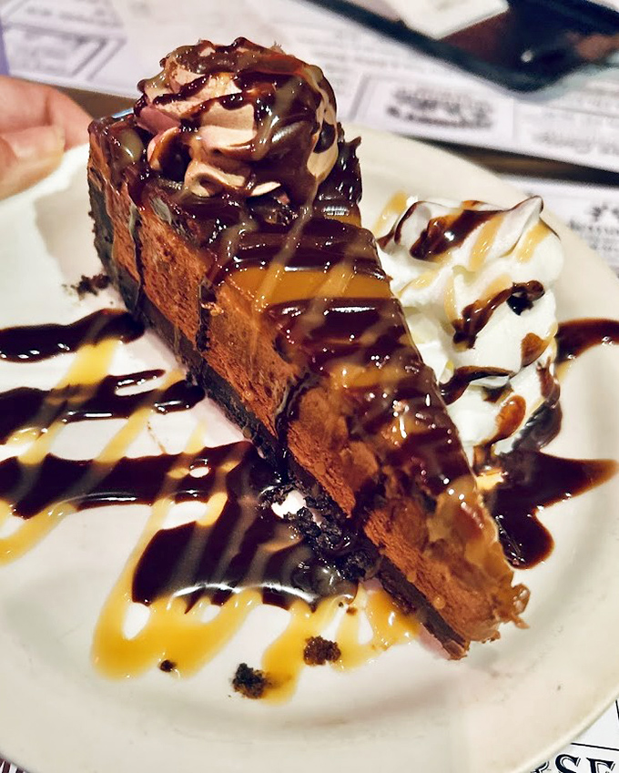 This isn't just dessert &ndash; it's architecture. Layers of chocolate, caramel, and whipped cream creating a skyline of sweetness that demands to be demolished.