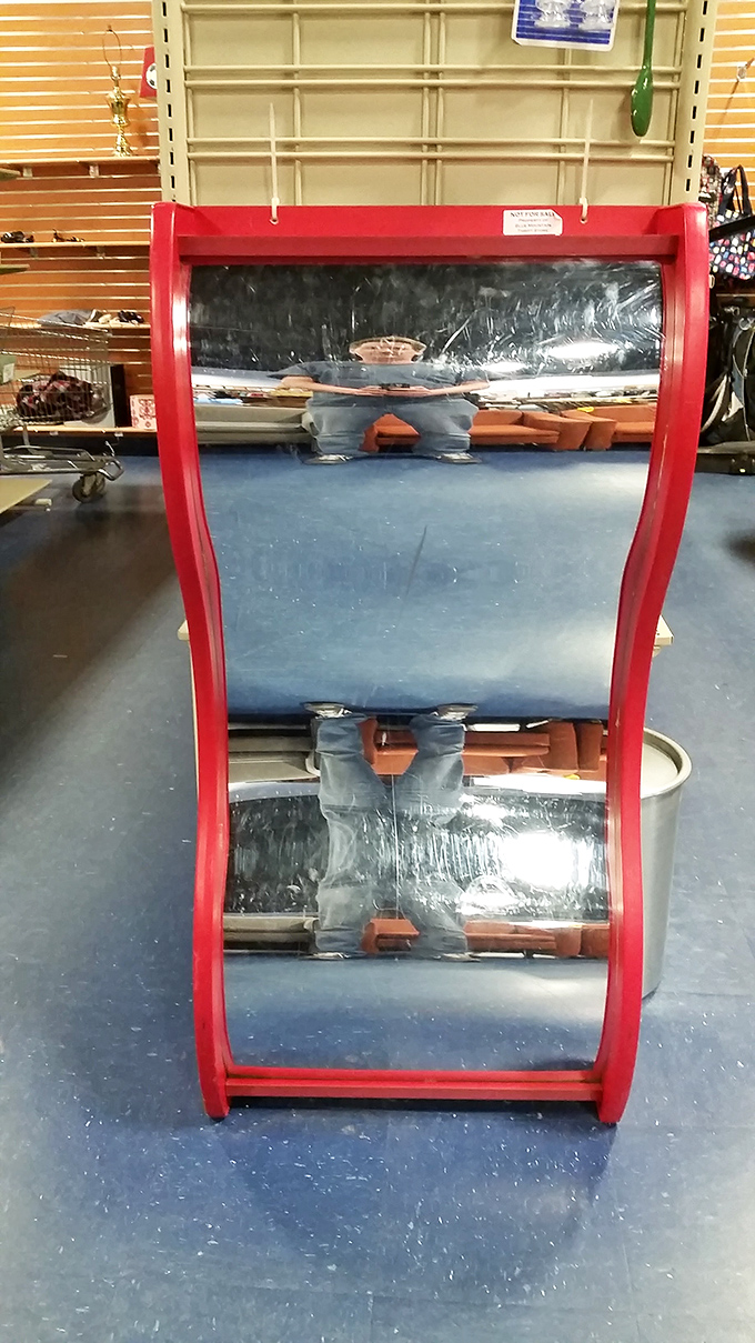 This vintage red-framed mirror doesn't just reflect your image&mdash;it reflects your excellent taste in bargain hunting.