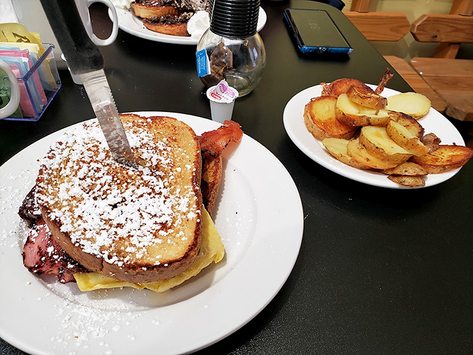 The Monte Cristo: where breakfast and lunch have a delicious identity crisis, topped with powdered sugar because why choose between sweet and savory?