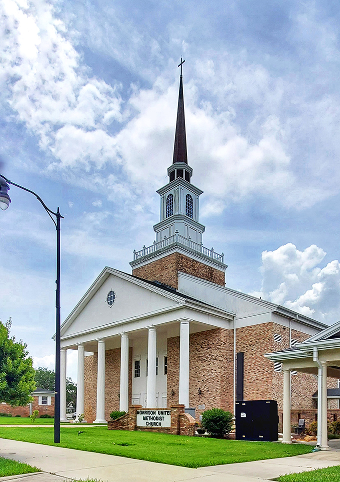 Morrison United Methodist Church's soaring steeple reaches skyward like a spiritual exclamation point, its brick and white fa&ccedil;ade a landmark of community faith.