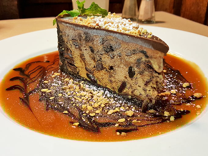 This mud pie isn't playing around&mdash;layers of chocolate decadence swimming in caramel sauce with a sprinkle of nuts for that perfect textural crescendo.