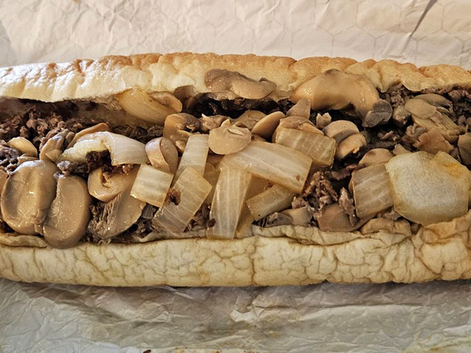 Mushrooms and onions transform an already perfect cheesesteak into something transcendent. The fungi fanatic's dream sandwich.