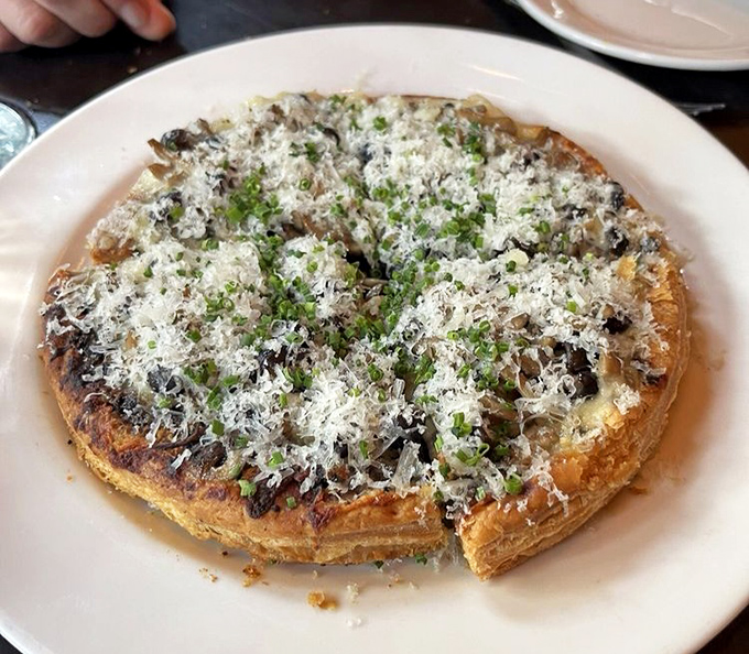 This mushroom tart isn't just a dish&mdash;it's architecture. Layers of buttery pastry and earthy mushrooms create a cathedral of flavor worth worshipping.