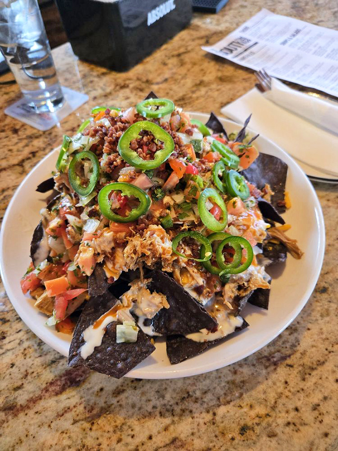 These loaded nachos aren't messing around – every chip carries its weight in toppings and flavor explosions.