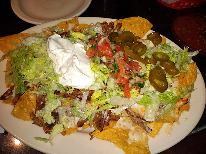 These loaded nachos aren't just a starter; they're a commitment, a mountain of flavor that demands both strategy and dedication.