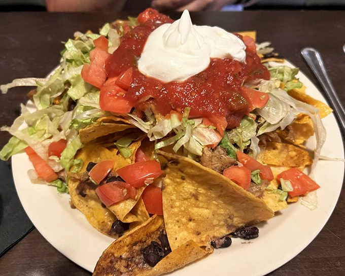 Nachos piled high enough to require structural engineering consultation &ndash; bring your appetite and maybe some backup.