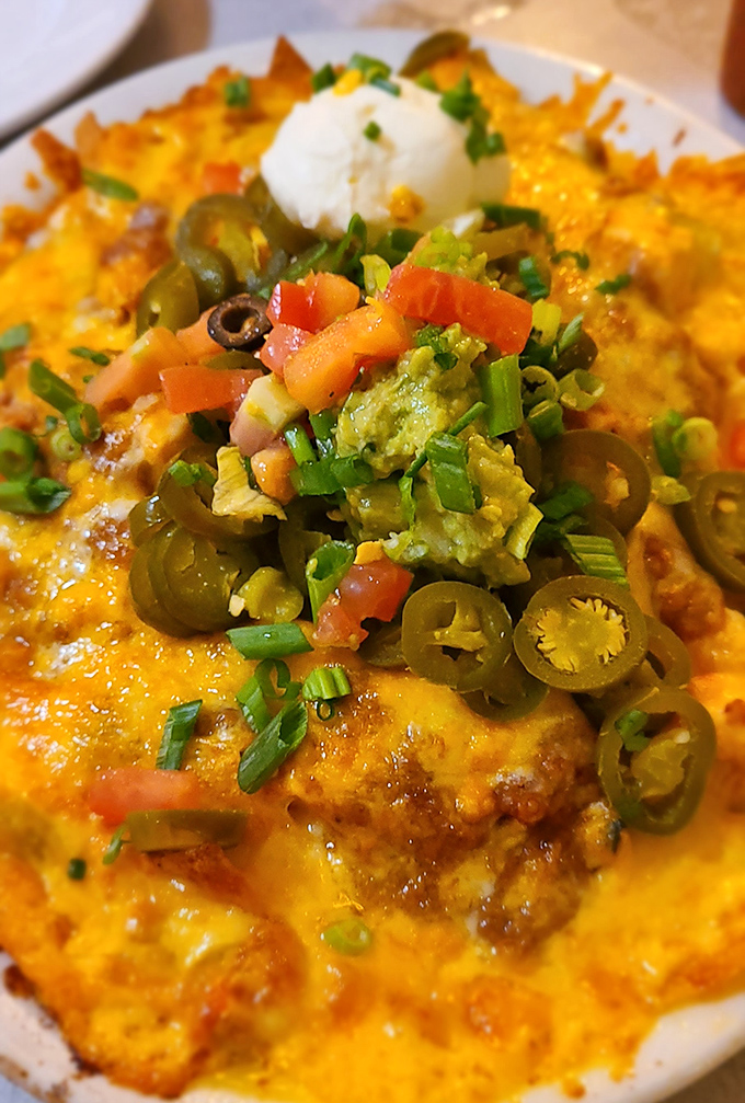 These loaded nachos don't just speak&mdash;they sing with layers of cheese, jalape&ntilde;os, guacamole, and all the fixings. Sharing optional but not recommended.