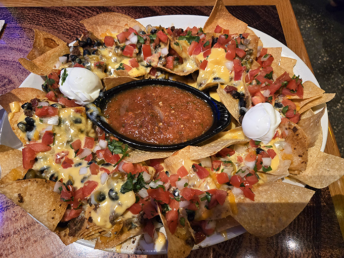 Nachos that require a topographical map to navigate &ndash; valleys of cheese, mountains of toppings, and a central crater of salsa for adventurous dipping.
