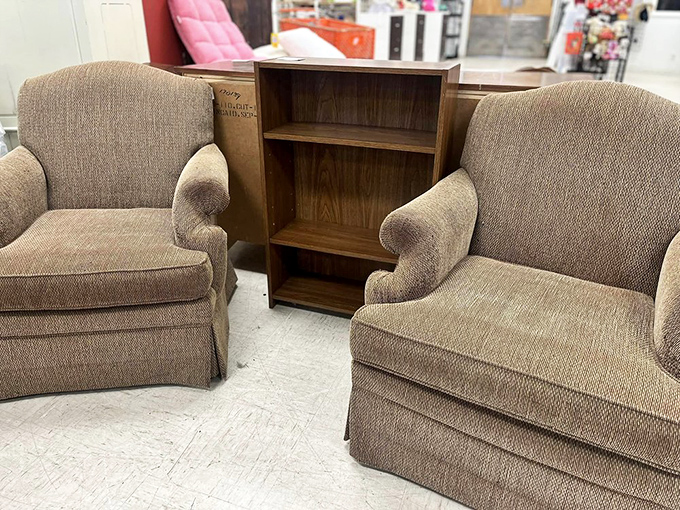 Cozy club chairs flanking a bookshelf&mdash;the perfect setup for those "I'm just going to read for five minutes" sessions that become hours.