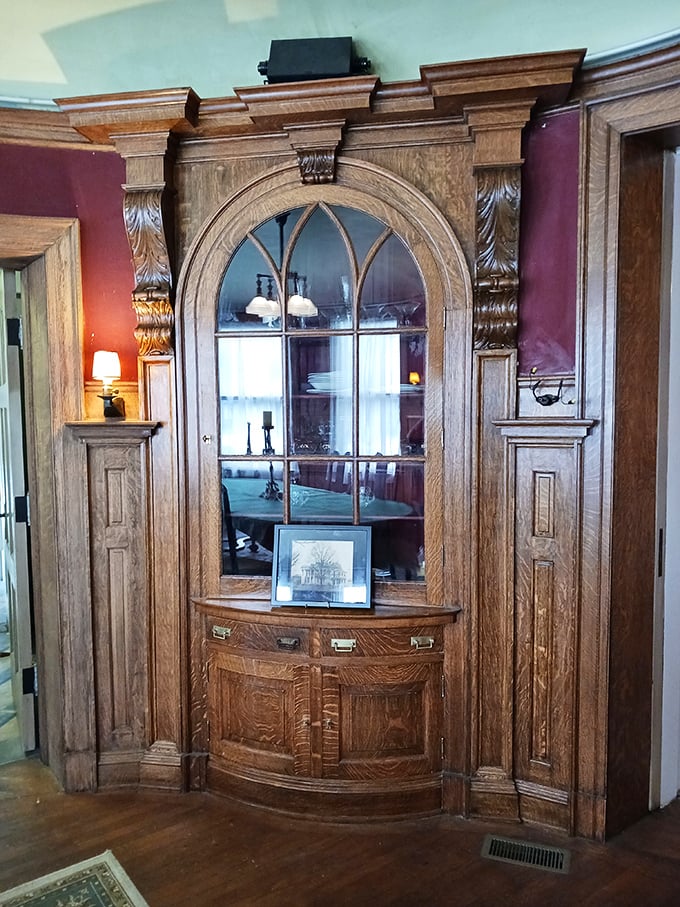 This built-in cabinet isn't just furniture&mdash;it's functional art, with arched glass that transforms ordinary dishes into museum-worthy displays.