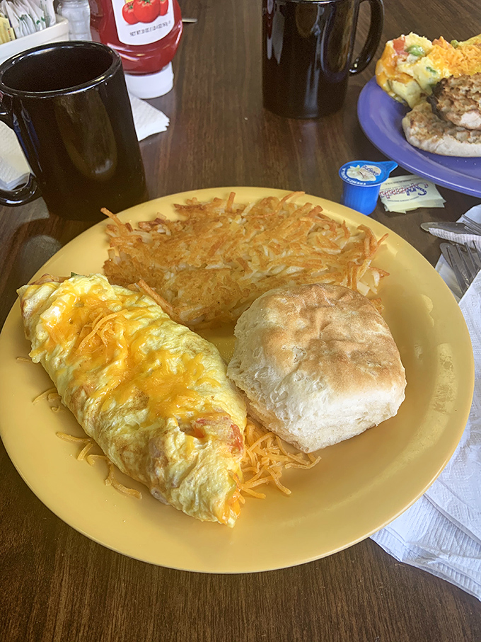 An omelet that knows its purpose in life is to deliver cheese, perfectly cooked eggs, and a side of those legendary hash browns.