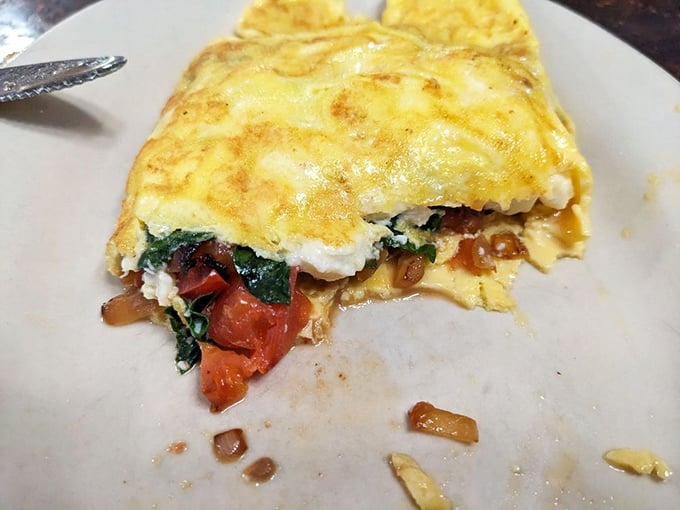 This isn't just any omelet &ndash; it's a fluffy envelope of eggs delivering a love letter of vegetables and cheese to your taste buds.