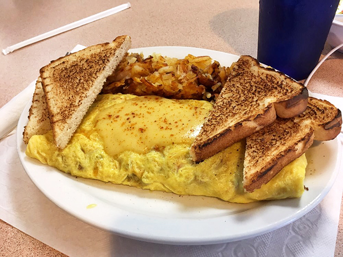 This isn't just an omelet&mdash;it's a perfectly folded envelope delivering a message of breakfast joy, with crispy toast as the exclamation point.