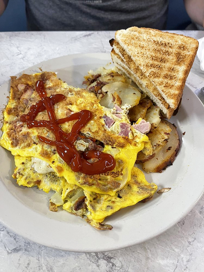 An omelet that remembers what breakfast is supposed to be: hearty, honest, and substantial enough to fuel actual work, not just keyboard tapping.