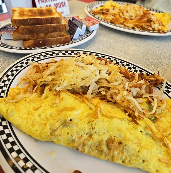 This omelet didn't just happen&mdash;it was crafted by hands that have flipped thousands before it, topped with hash browns crisped to perfection.