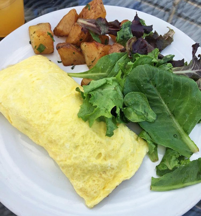 Breakfast with a view: this fluffy omelet and seasoned potatoes prove that morning meals aboard ship outrank continental breakfast anywhere on land.