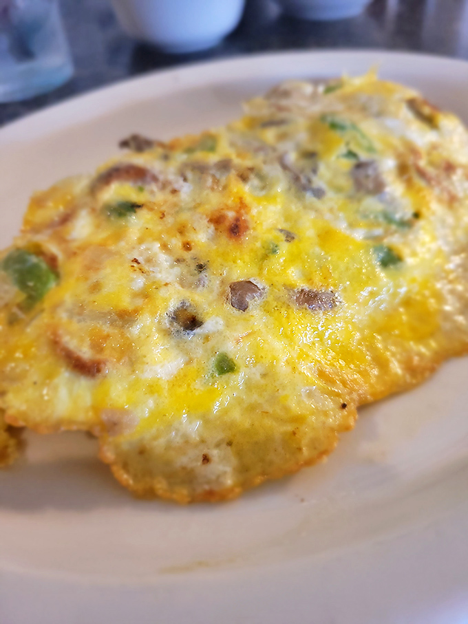 An omelet that doesn't just contain vegetables&mdash;it celebrates them under a golden canopy of perfectly cooked eggs and melted cheese.