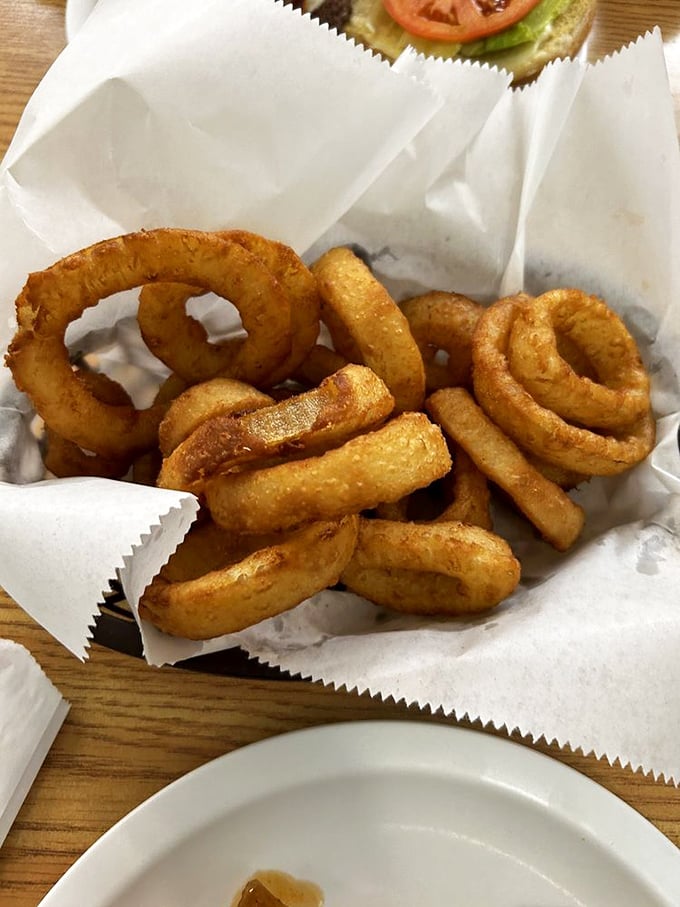 These onion rings aren't just fried &ndash; they're golden halos of happiness, crispy enough to make angels weep with joy.