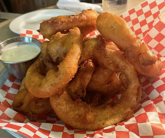 Golden-battered glory: These onion rings aren't just side dishes&mdash;they're crispy halos of happiness that deserve their own spotlight and standing ovation.