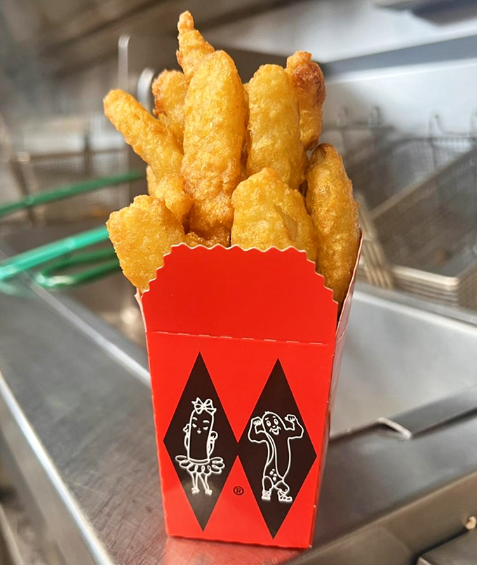 These aren't just onion rings; they're golden halos of happiness that shatter with a satisfying crunch before melting into sweet oniony bliss. 