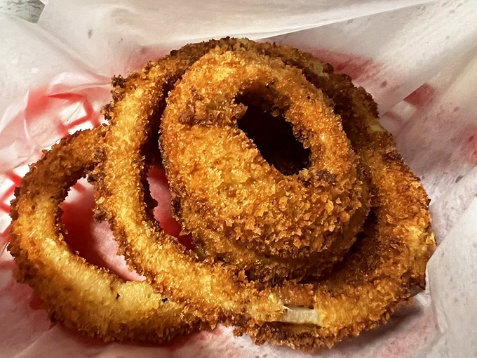 These onion rings aren't just side dishes&mdash;they're golden halos of happiness that crunch loud enough to drown out your diet's protests.