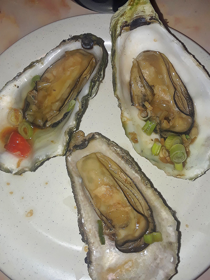 These oysters aren't just served, they're presented&mdash;plump, briny treasures nestled in their shells with delicate garnishes that show someone in the kitchen cares.