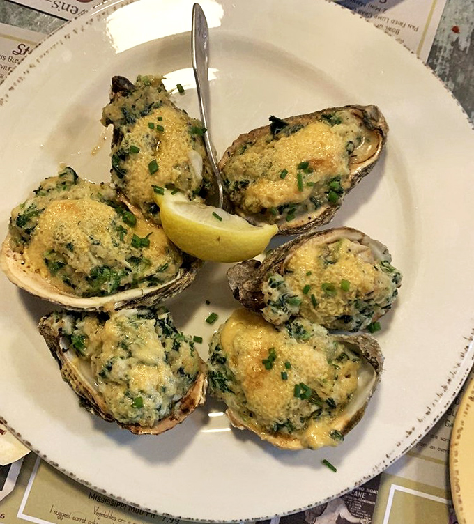 Oysters Rockefeller so decadent they should come with their own tax bracket. Green, creamy, and broiled to bubbly perfection.