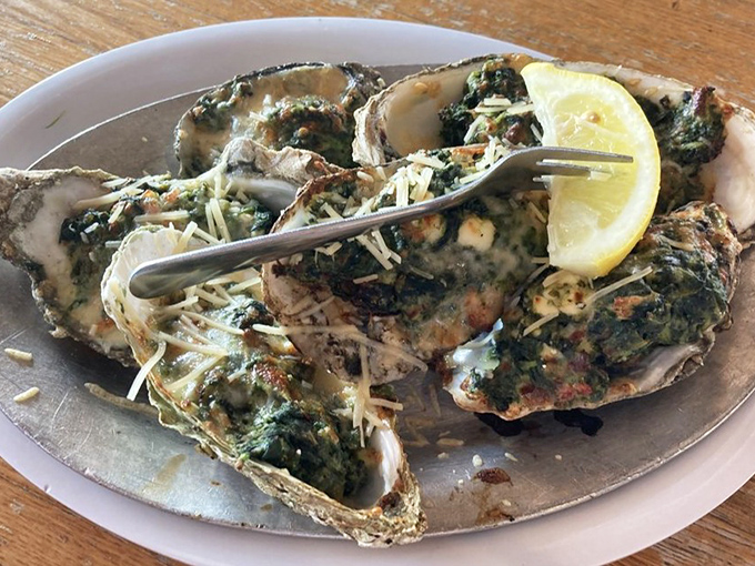Oysters Rockefeller – where spinach finally gets the respect it deserves by dressing up briny bivalves in their Sunday best.