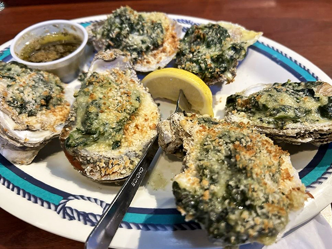 These Oysters Rockefeller are dressed better than most people at a Florida wedding &ndash; spinach, cheese, and a hint of anise creating seafood magic.