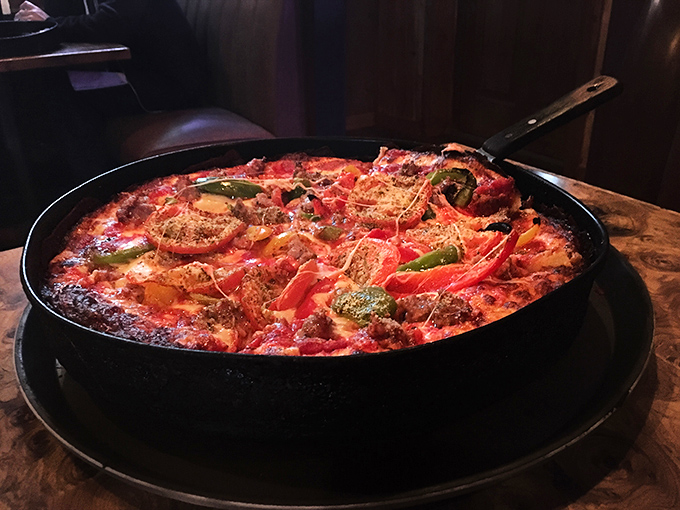 A colorful pan pizza loaded with toppings that somehow maintains structural integrity &ndash; engineering and culinary arts in perfect harmony.