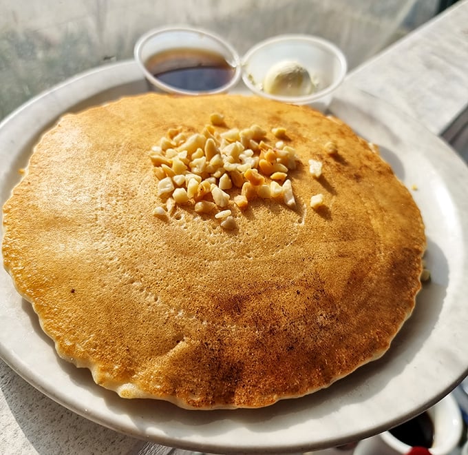 This macadamia nut pancake isn't just breakfast, it's an edible postcard from paradise that somehow landed in Pasadena instead of Hawaii.